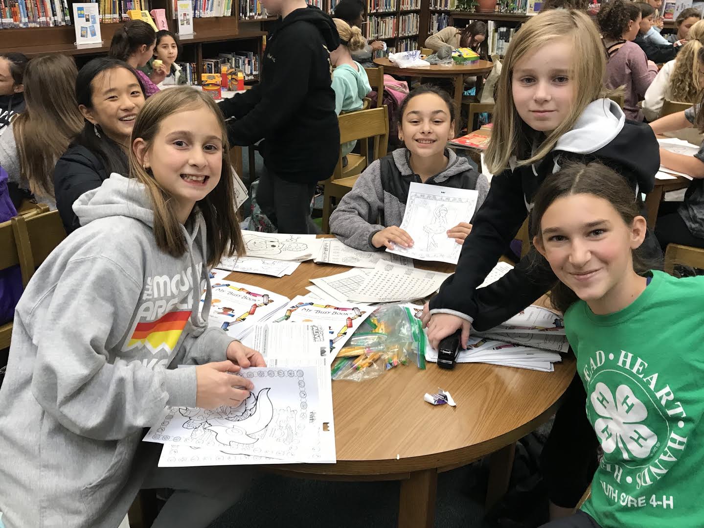Islip Middle Schoolers get ‘busy’ with book donations | Team Up 4 Community