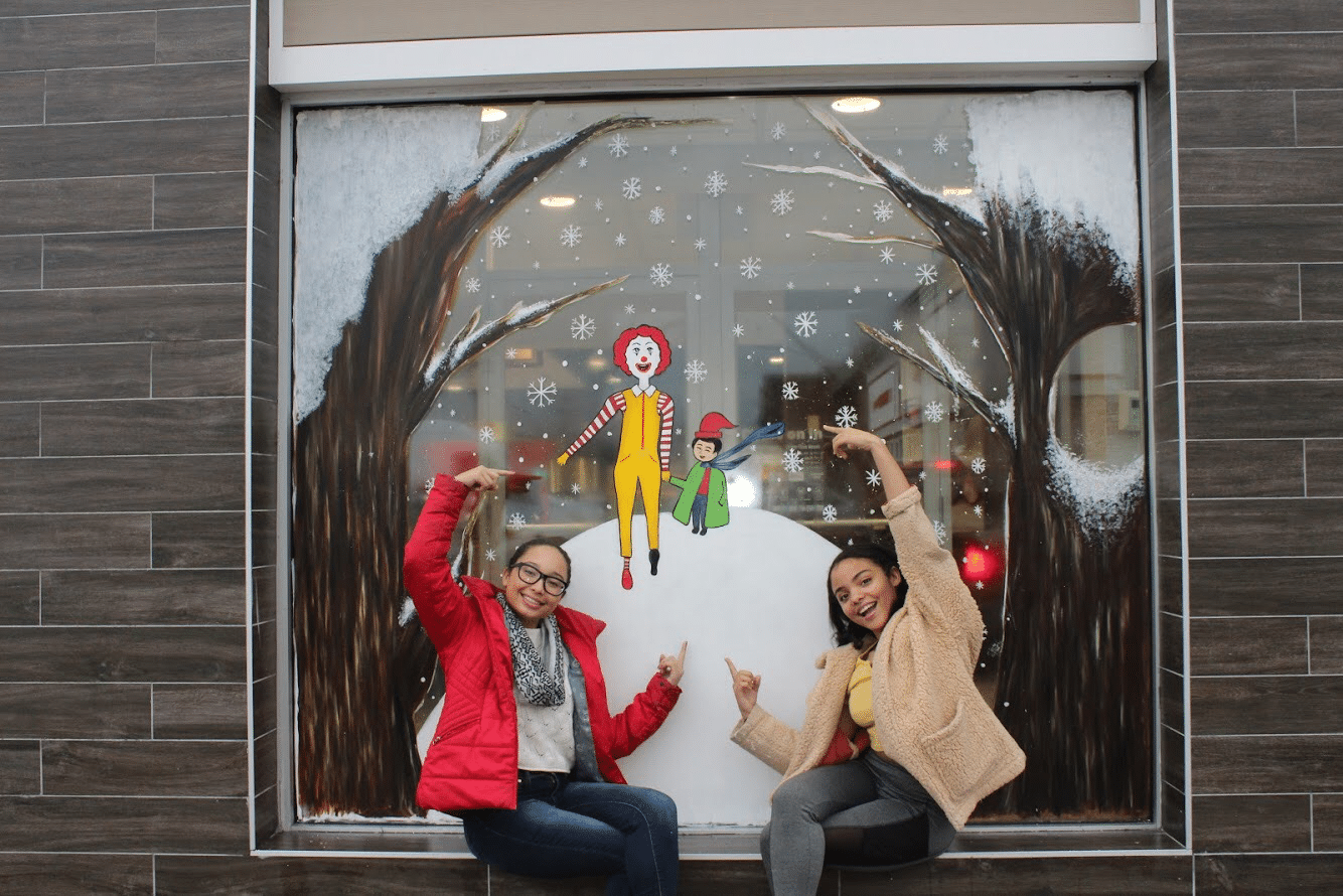 Glen Cove High School students paint store windows | Team Up 4 Community