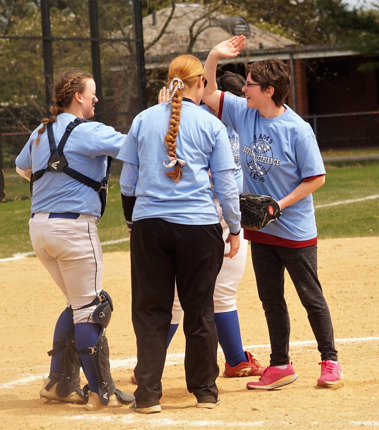 East Meadow softball teams play exhibition games for autism awareness ...
