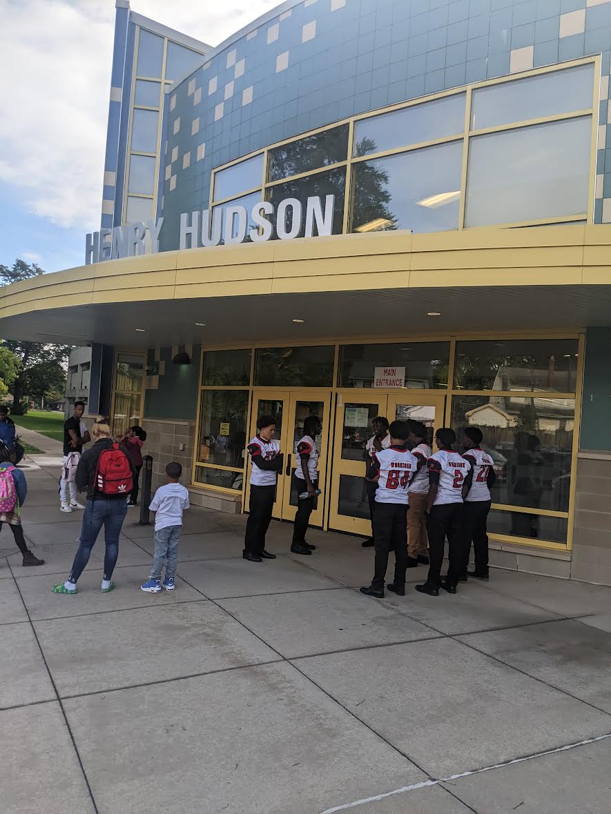 Vertus High School Football greet students at neighboring elementary ...