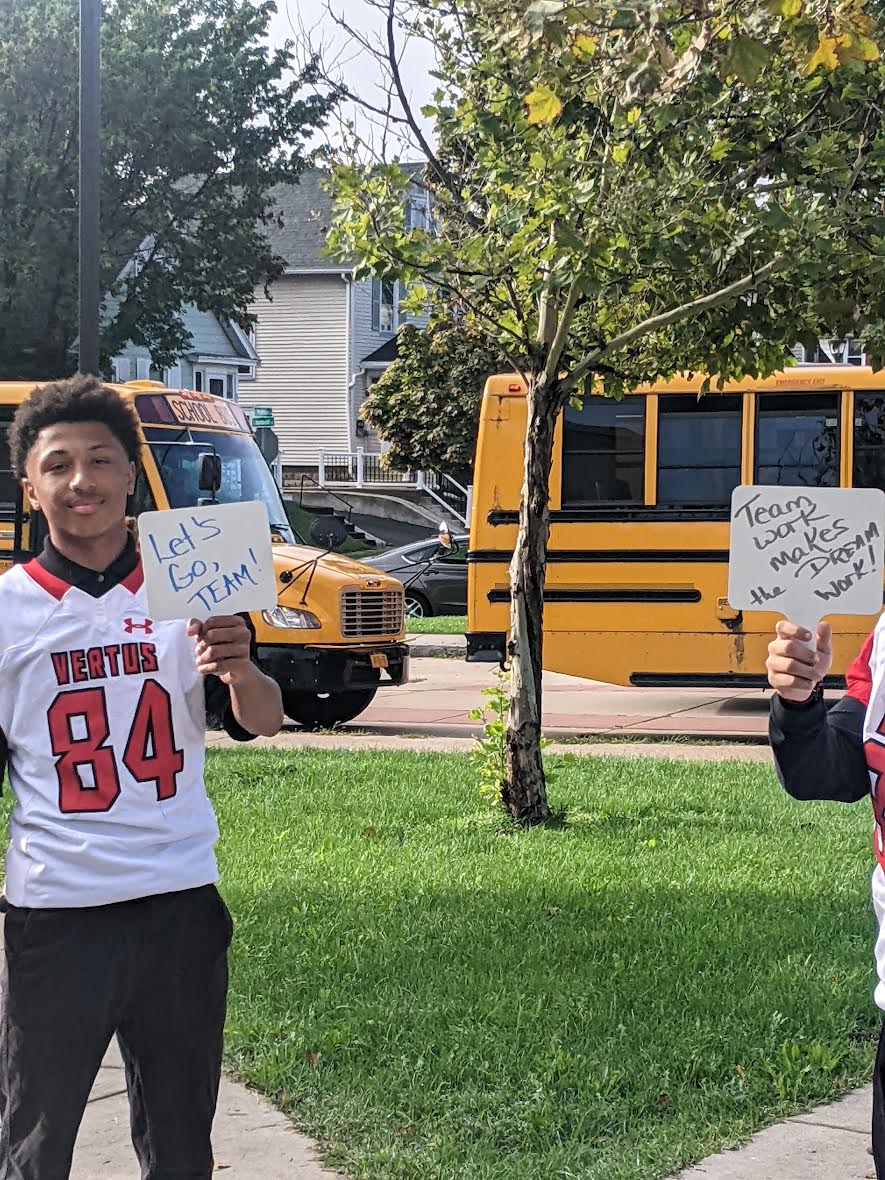 Vertus High School Football greet students at neighboring elementary ...