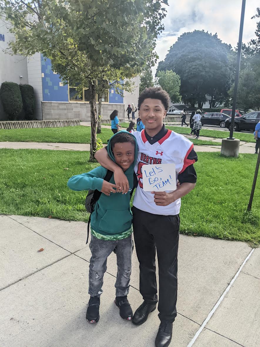 Vertus High School Football greet students at neighboring elementary ...